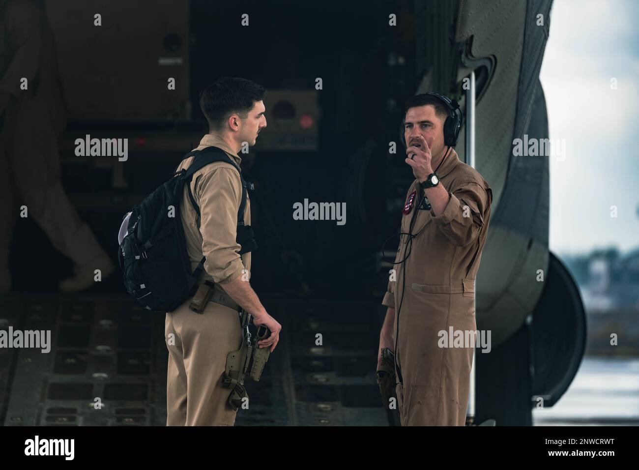 U.S. Marine Corps Capt. Eric Wilfong, a KC-130J pilot, left, and ...
