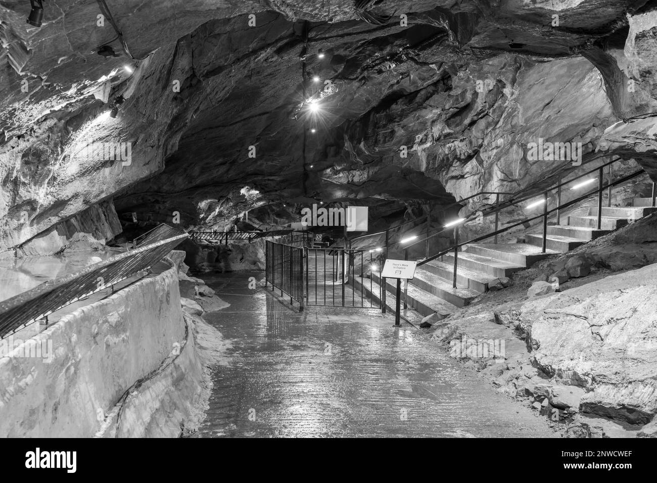 An illuminated staircase inside Goughs Cave in Cheddar in Somerset ...