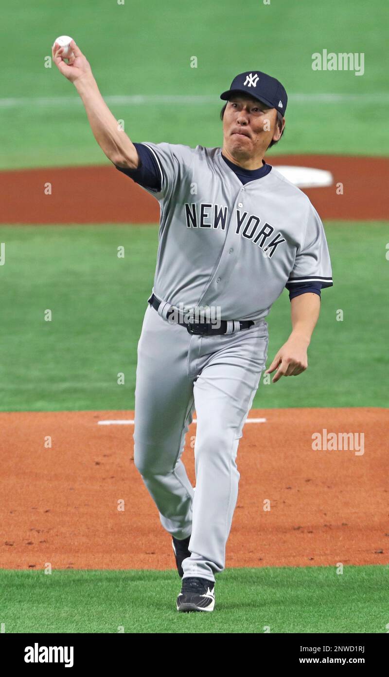 Hideki Matsui, nicknamed "Godzilla", throws out the ceremonial first pitch during a game of ...
