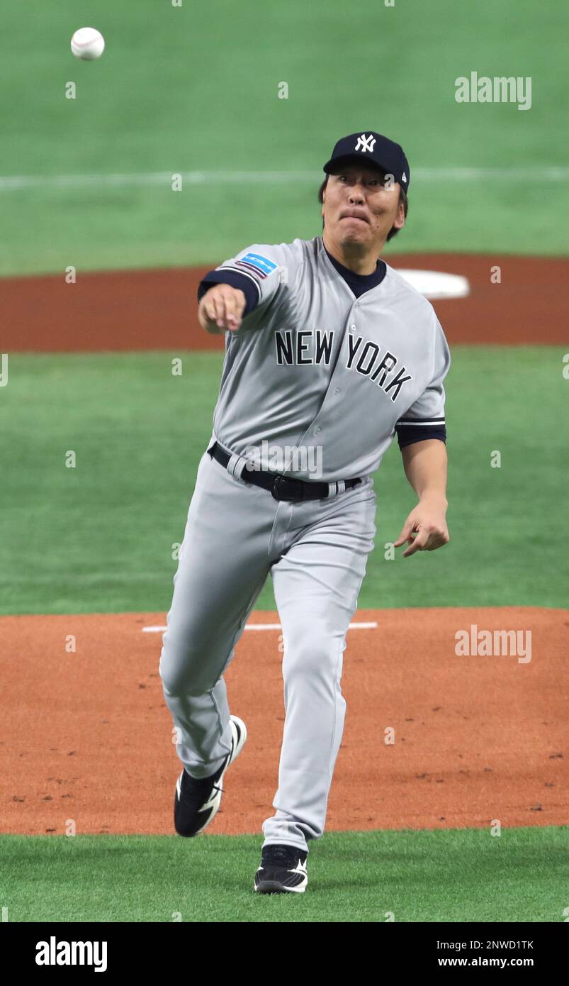 Hideki Matsui, nicknamed "Godzilla", throws out the ceremonial first pitch during a game of ...