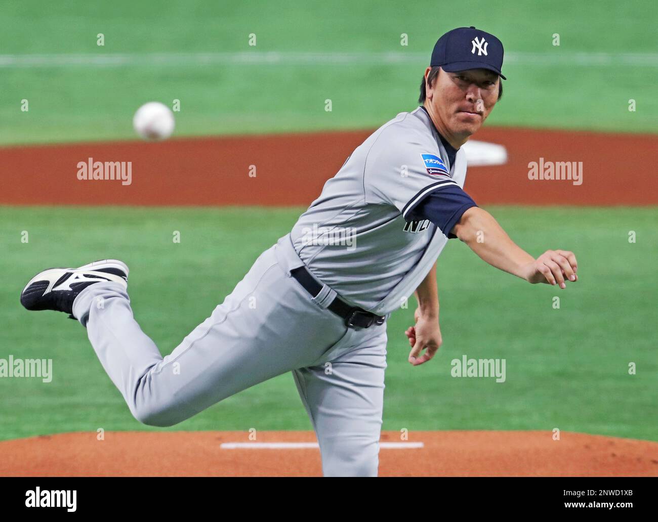Hideki Matsui, nicknamed "Godzilla", throws out the ceremonial first pitch during a game of ...