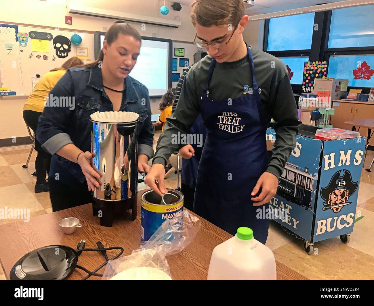 Andrew Gratzmiller makes coffee for the "HMS Treat Trolly" with his ...