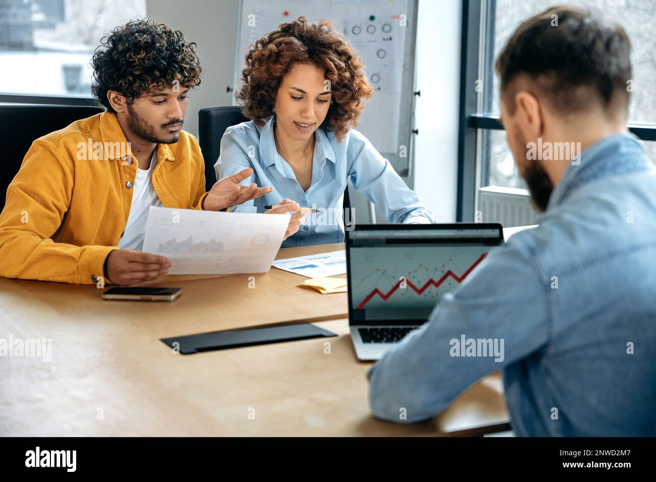 Focused successful motivated colleagues of different nationalities are ...