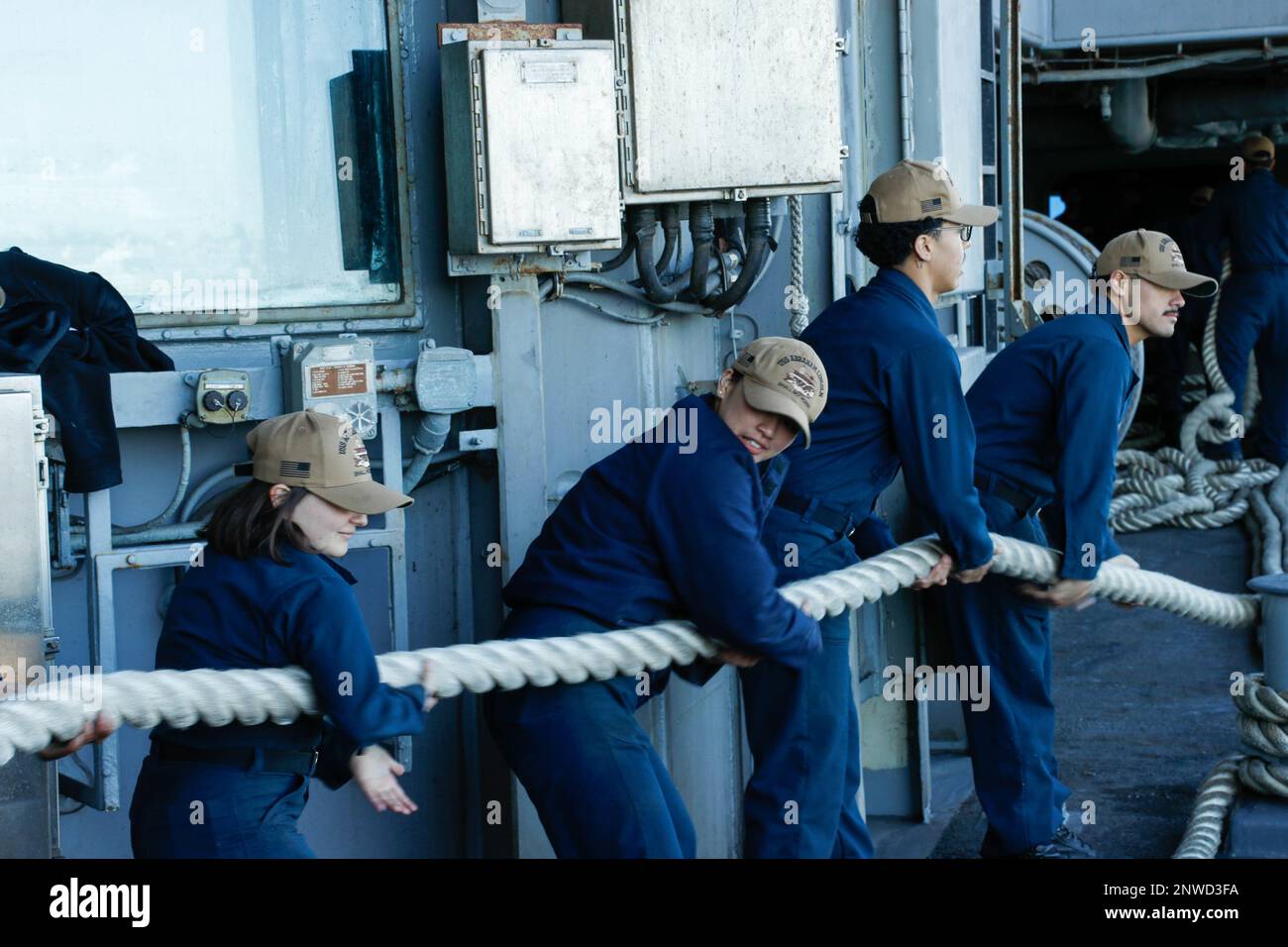 PACIFIC OCEAN (Jan. 23, 2023) Sailors heave lines during a sea and anchor evolution during a sea ...