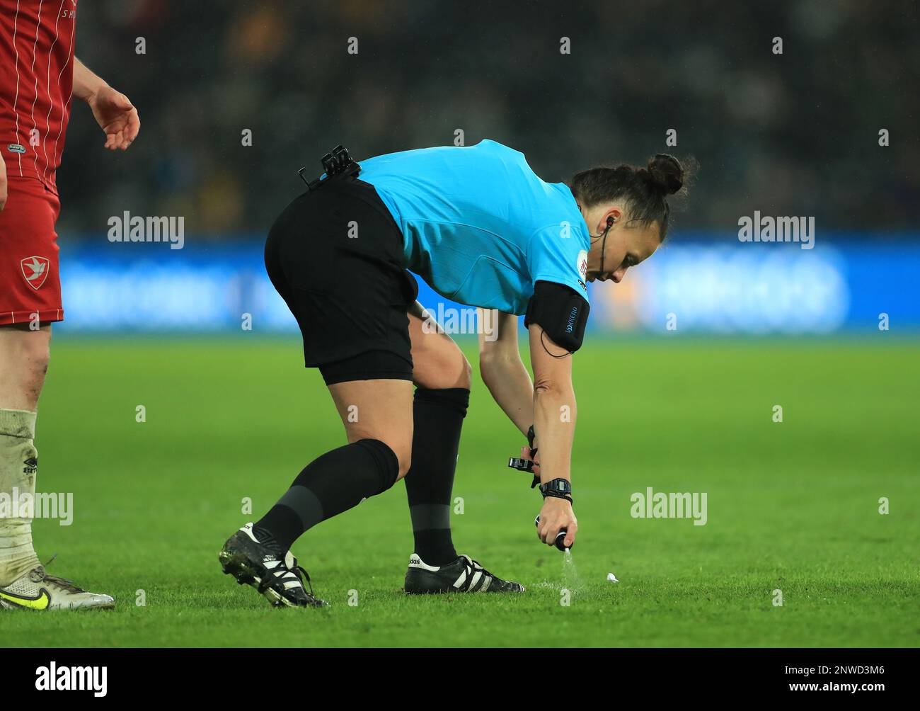 Referee Rebecca Welch marks a line on the pitch during the Sky Bet ...
