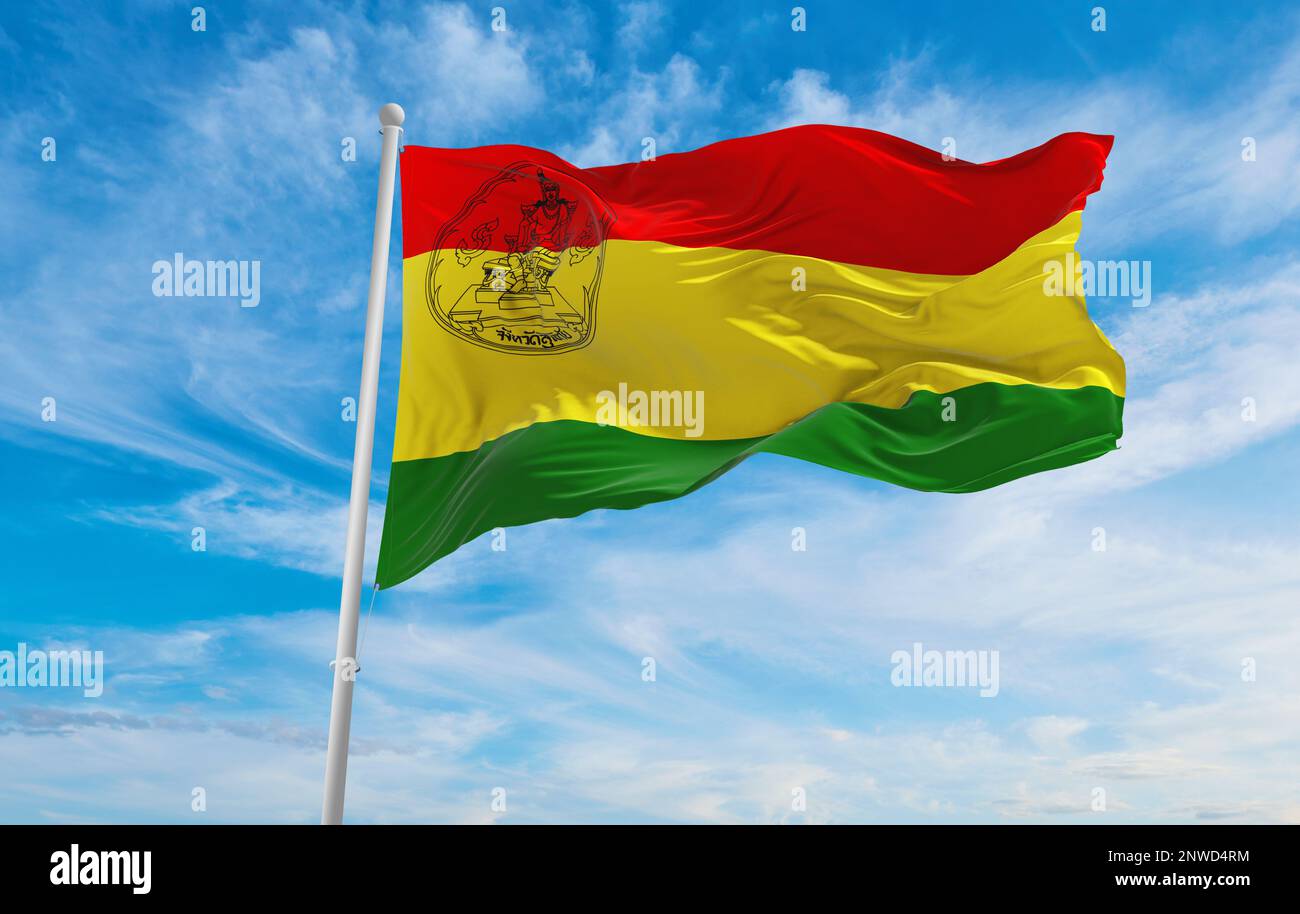 official flag of Sukhothai Province Thailand at cloudy sky background ...