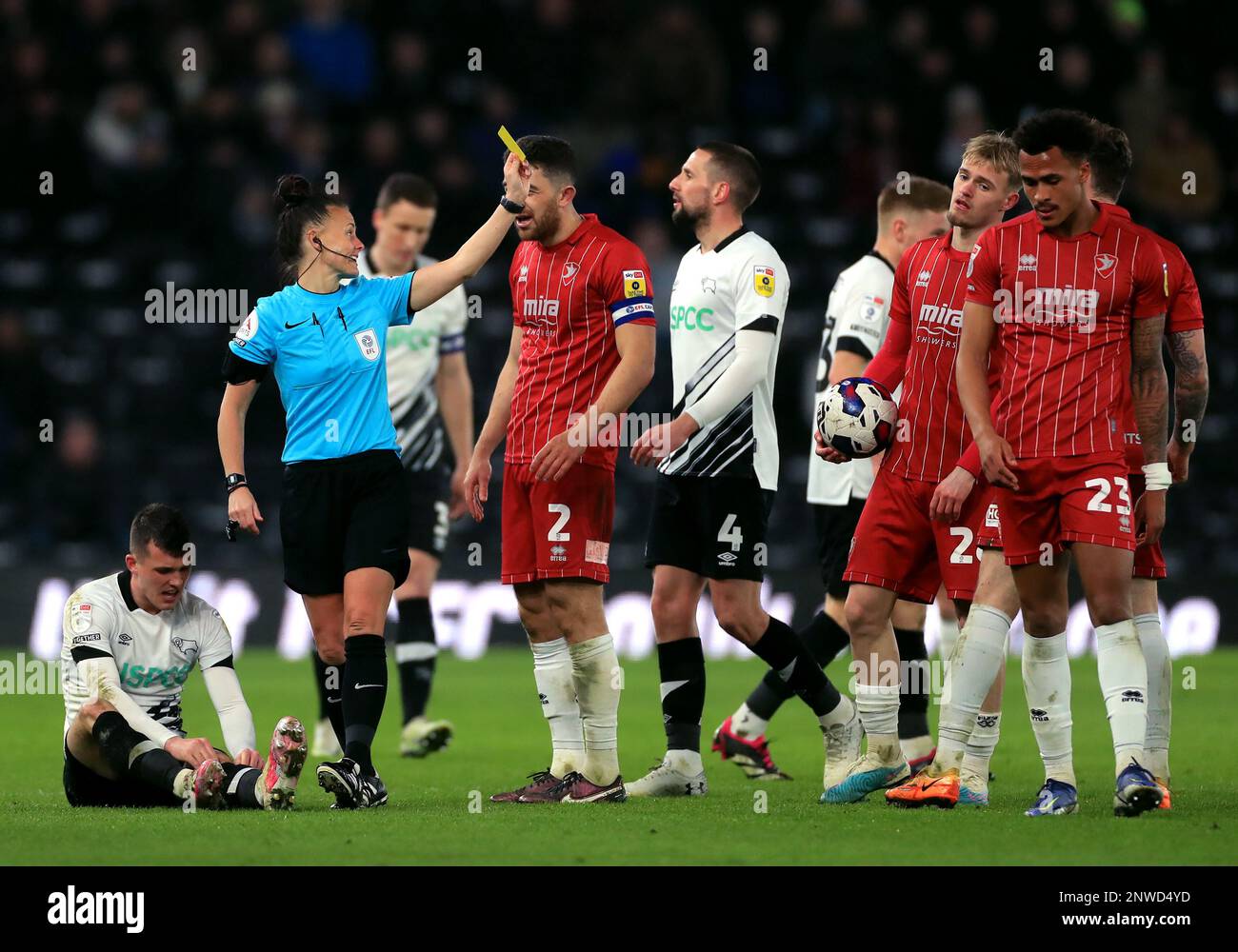 Referee Rebecca Welch shows a yellow card during the Sky Bet League One ...