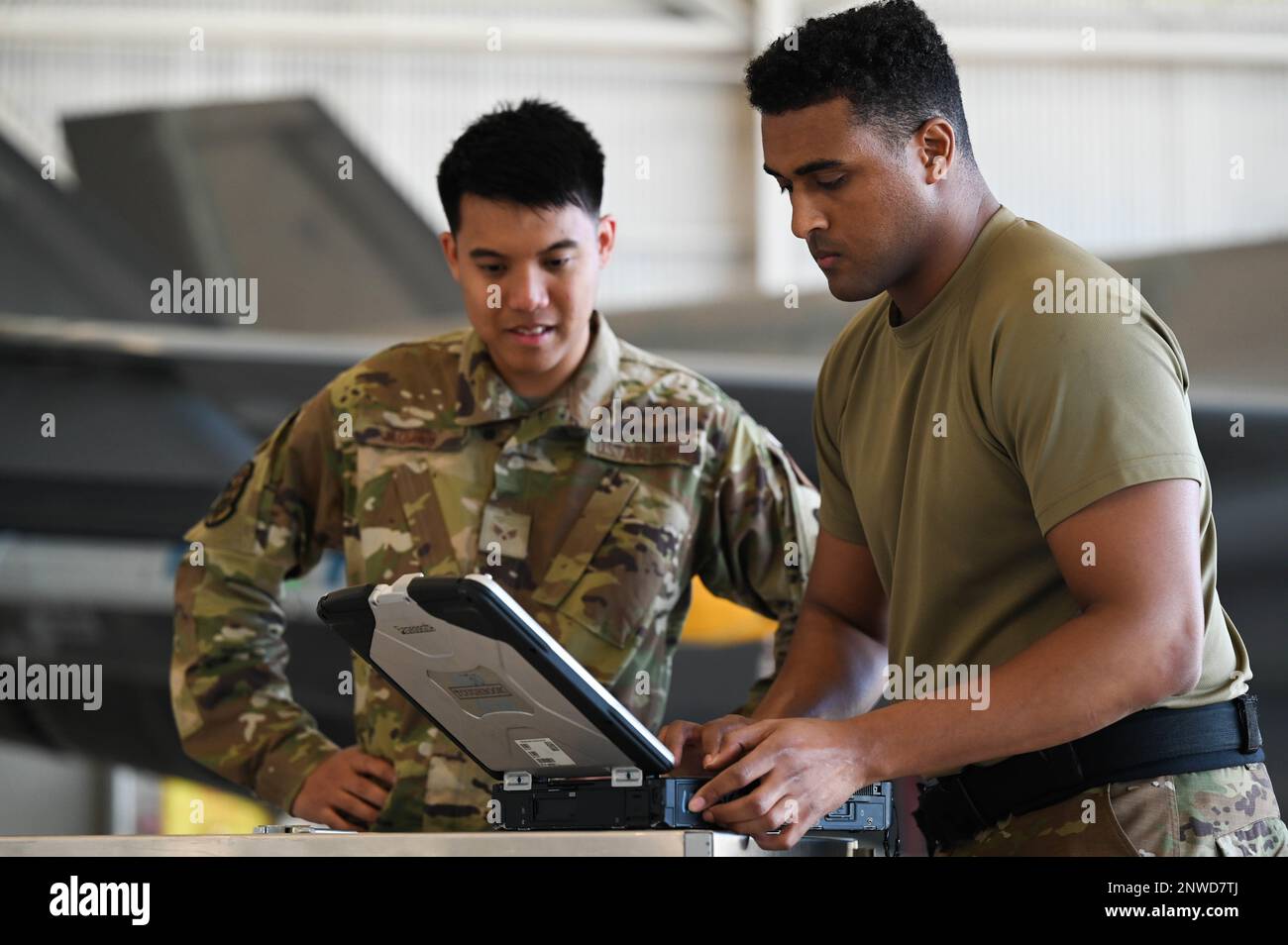 U.S. Air Force Senior Airman Zachary Aquino, left, a weapons load crew ...