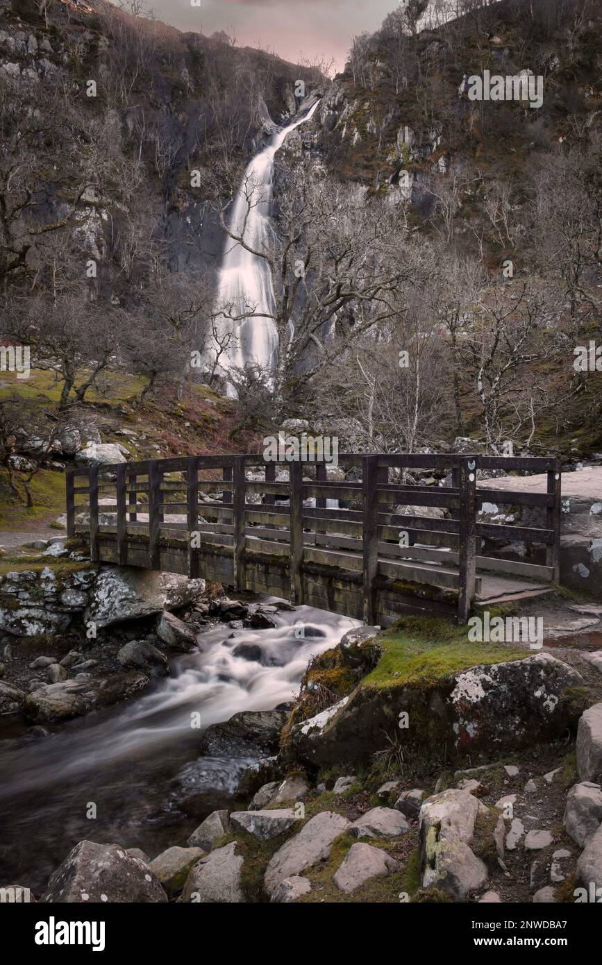 The wooden bridge at Aber Falls, a huge waterfall of about 37m near the ...