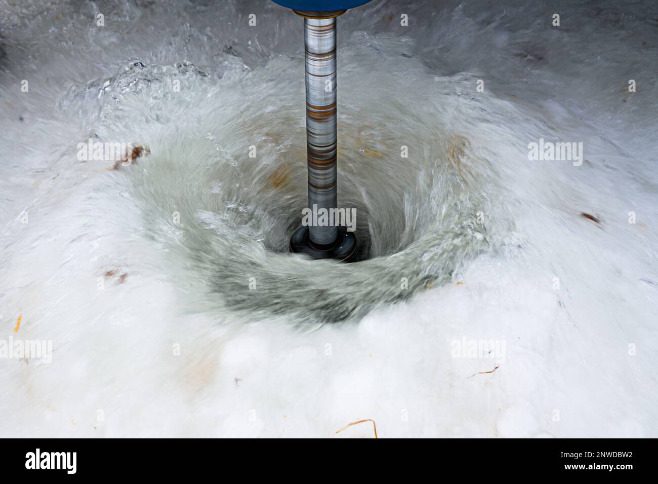 A BH-18 ice drill pumps out water from the ground at the Blair Lake ...