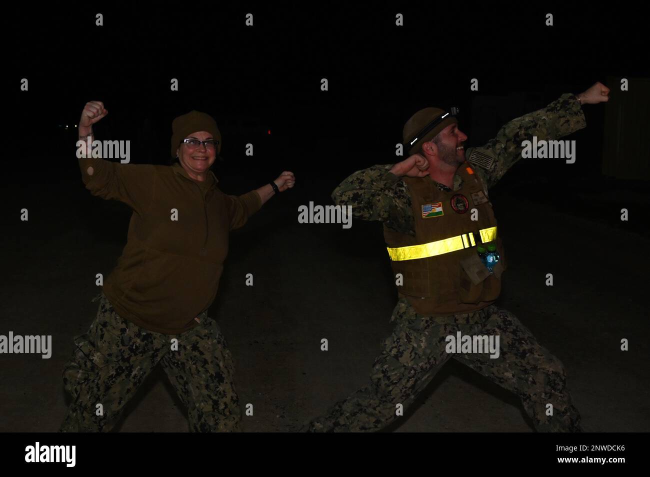 U.S. Navy Sailors strike a pose during the 13-mile DANCON march at Ali ...