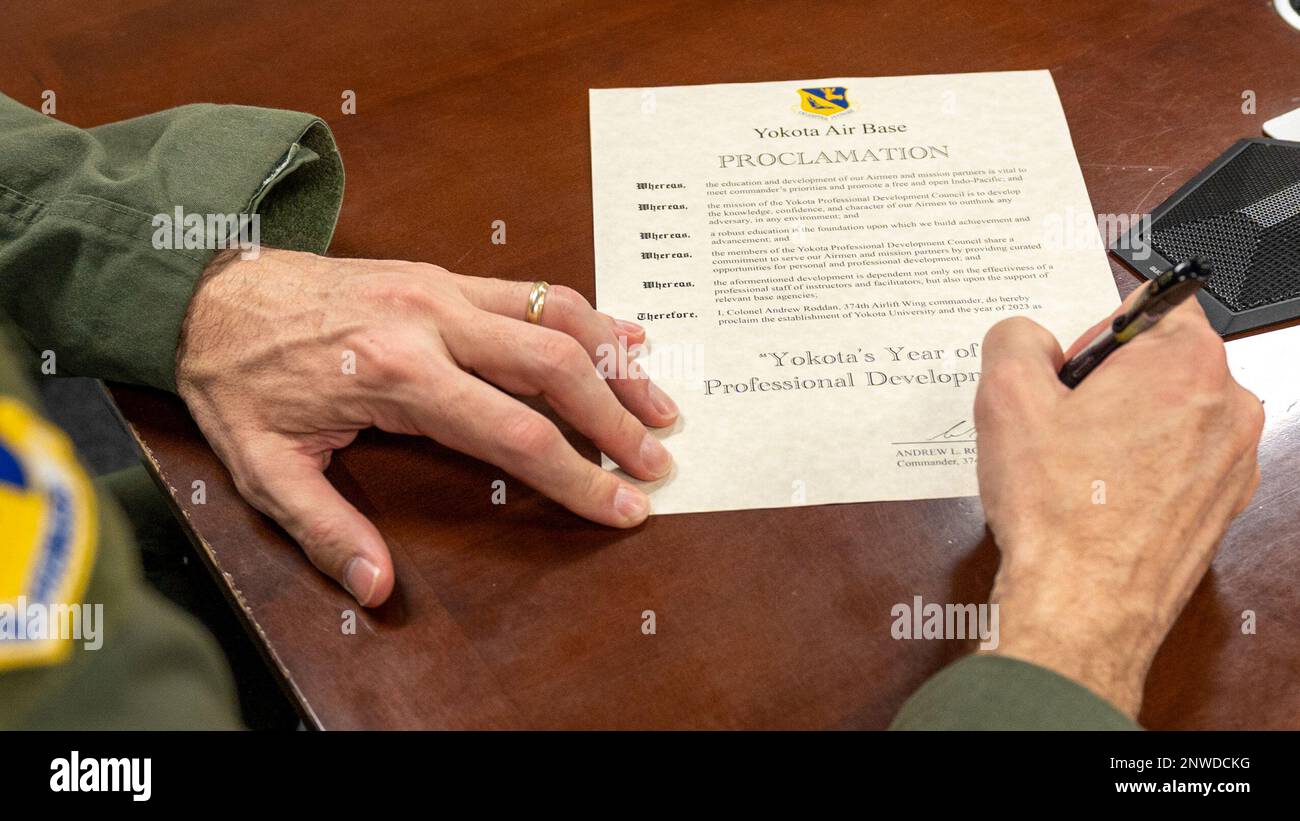 Col. Andrew Roddan, 374th Airlift Wing commander, signs a proclamation ...
