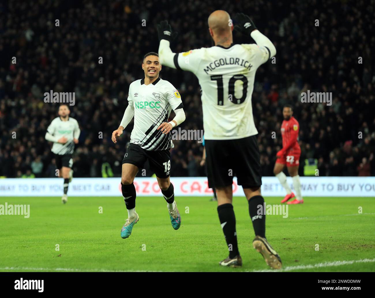 Derby County's Lewis Dobbin (centre left) celebrates scoring their side ...