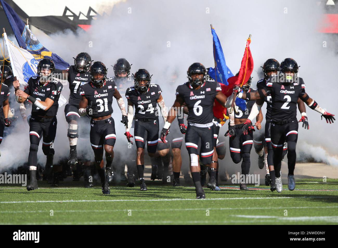 CINCINNATI, OH - NOVEMBER 03: Cincinnati Bearcats run onto the field ...
