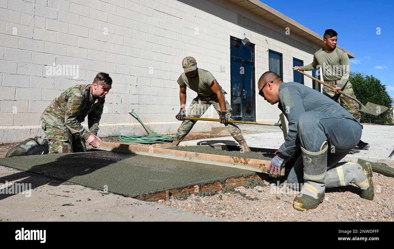 U.S. Air Force Airmen from the 355th Civil Engineer Squadron pour ...