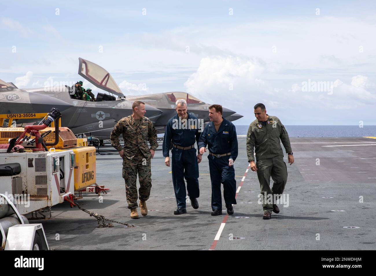 Rear Adm. Christopher Sweeney, commander, Carrier Strike Group (CSG) 11, Capt. Tony Chavez ...