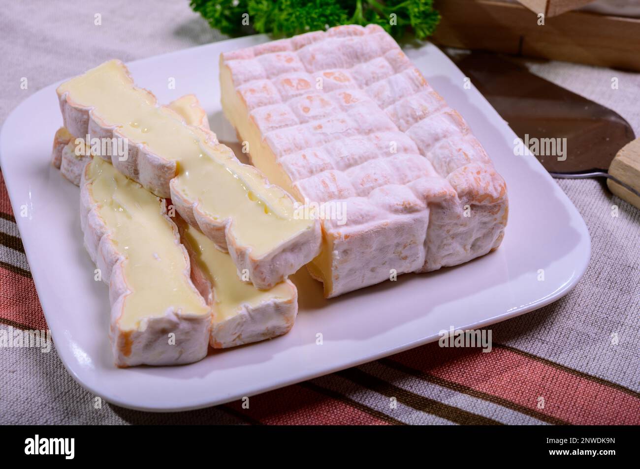 French cheeses collection, yellow Vieux Pane cheese with white mold ...