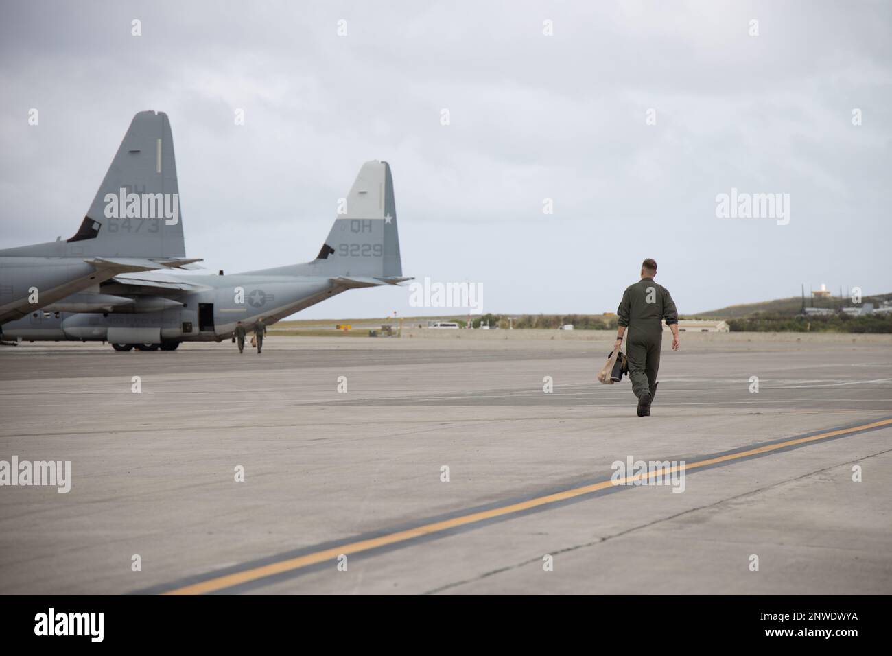 A U.S. Marine with Marine Aerial Refueler Transport Squadron 234 walks ...