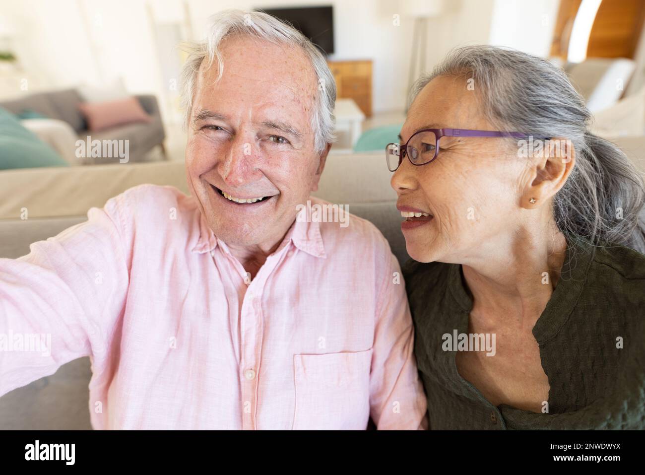 Happy senior diverse couple having video call Stock Photo - Alamy
