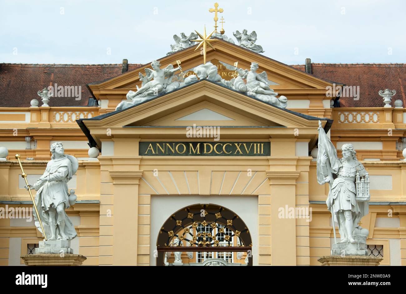 The view of a baroque style Melk Abbey entrance with sculptures and a ...