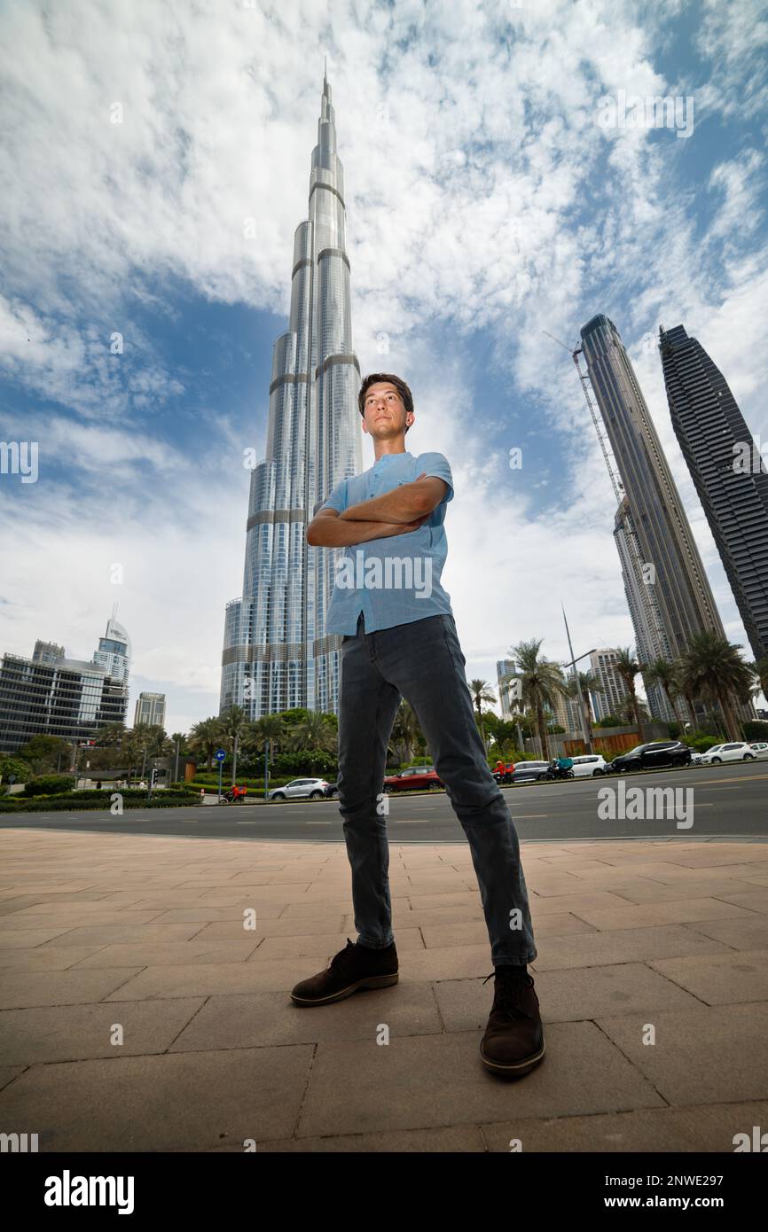 DUBAI, UAE.A man in looks at the background of the Burj Khalifa ...