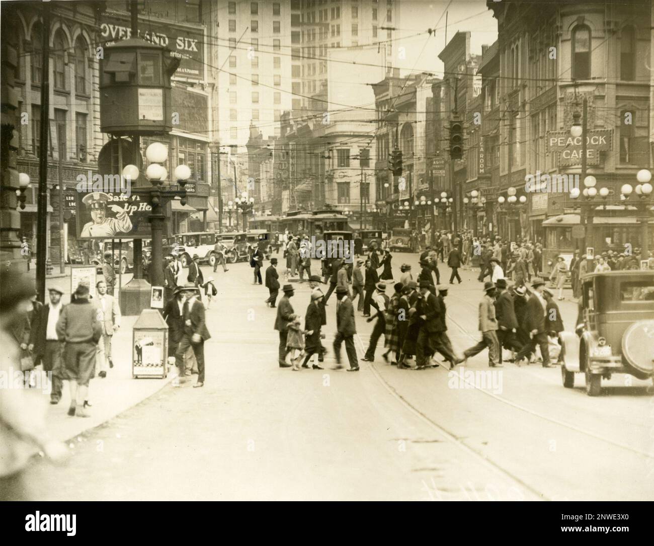 Bustling street scene of pedestrians and street cars in on Peachtree ...