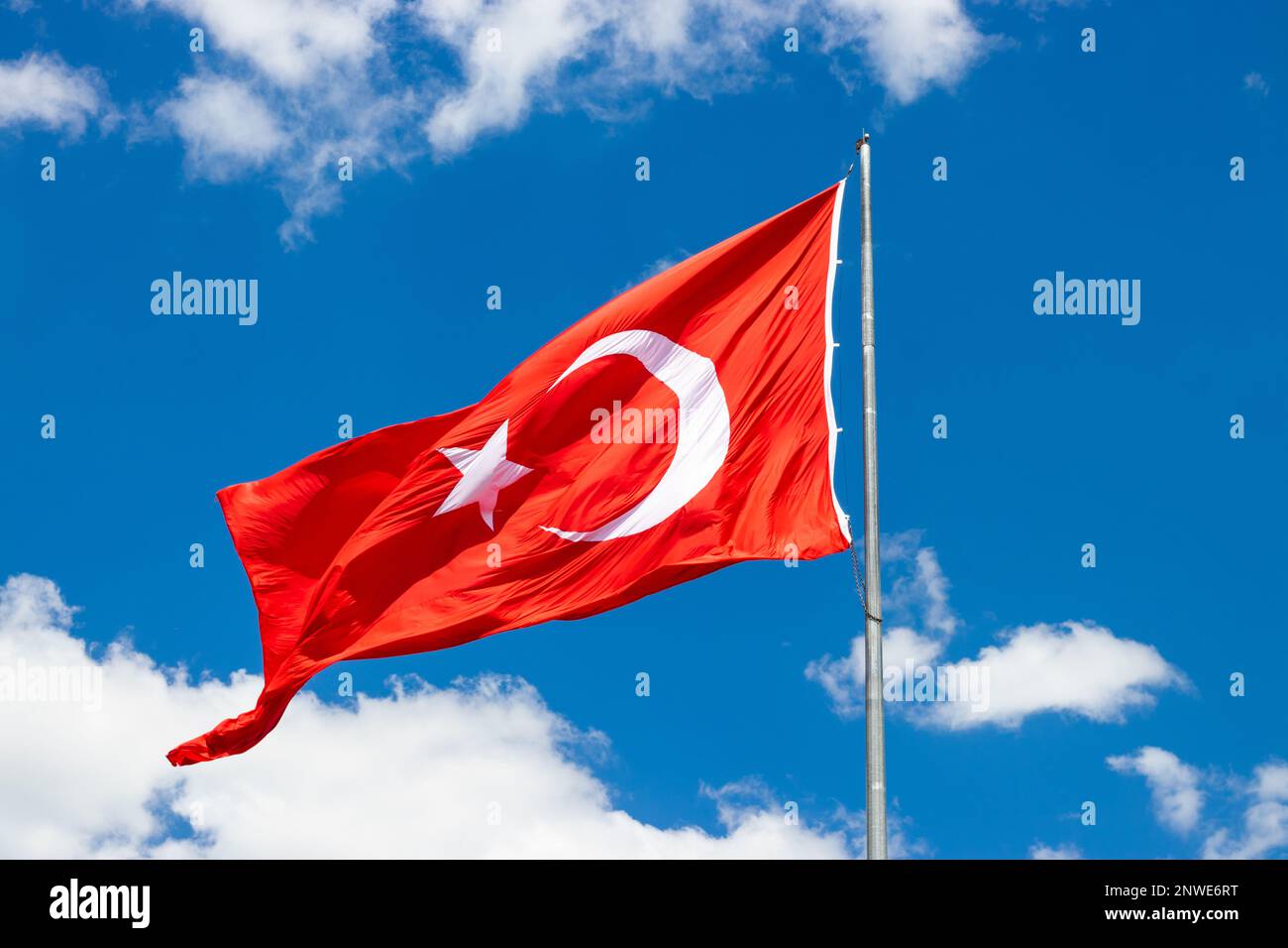 Waving Turkish flag. Sky background.Flag with star and crescent symbol ...