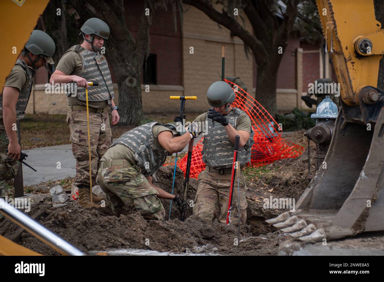 U.S. Airmen assigned to the 628th Civil Engineer Squadron excavate a ...