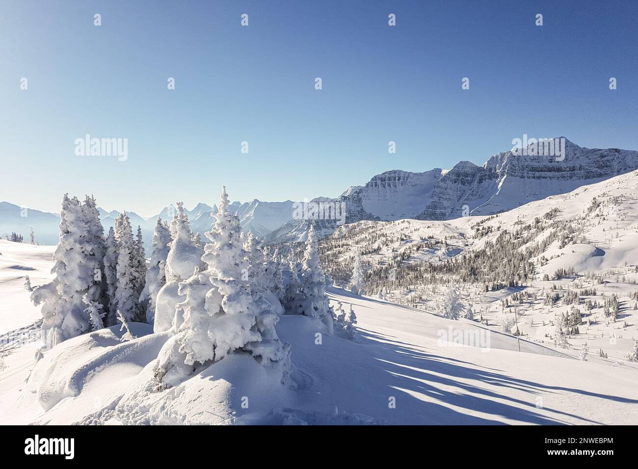 Wallpaper photo of snow capped mountain and blue sky background and ...