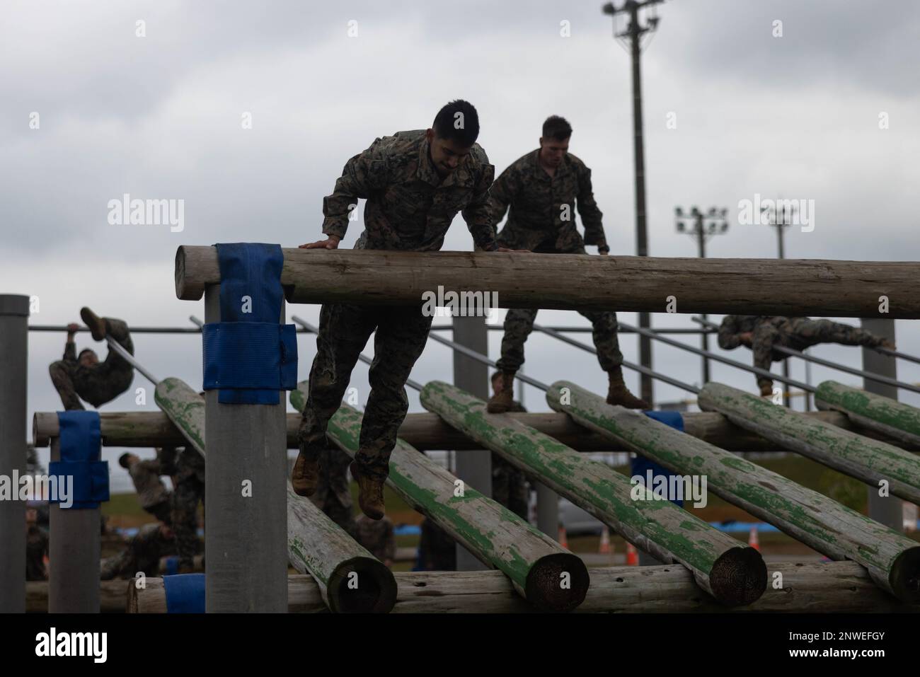 U.S. Marines with 3d Marine Division move through an obstacle course ...