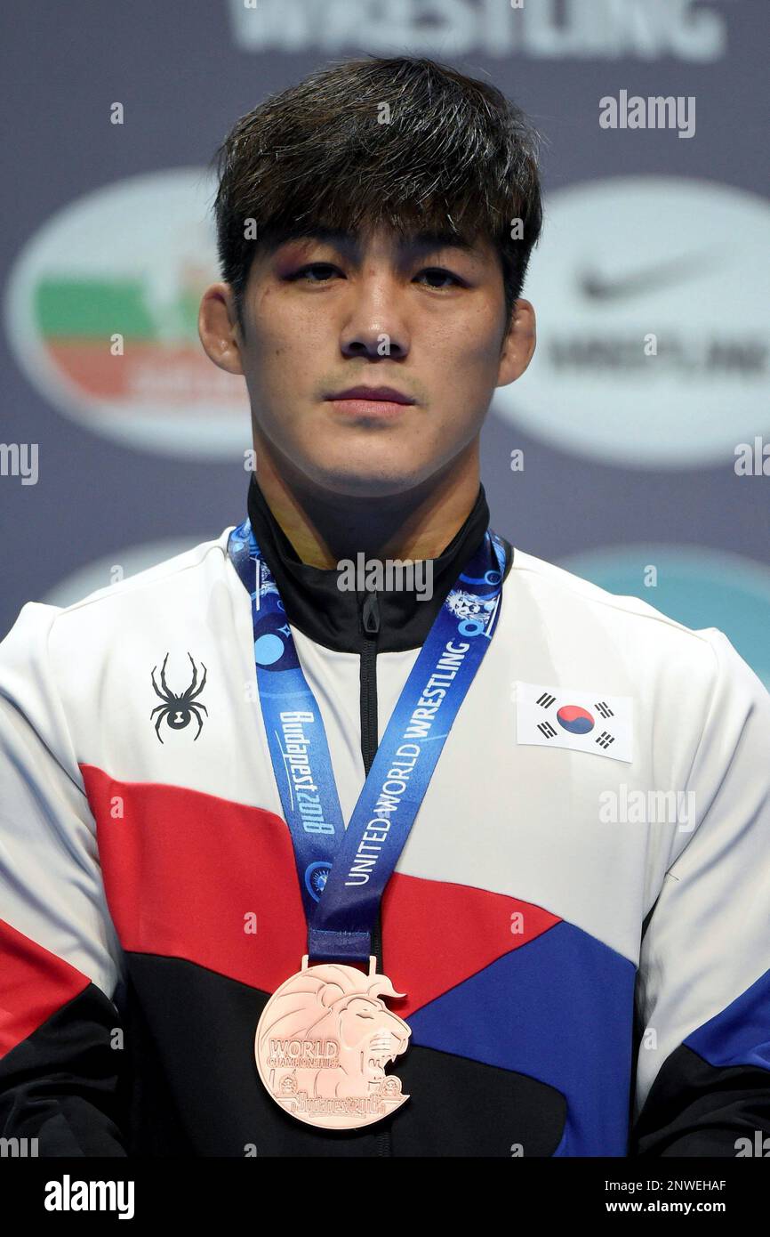 Bronze medalist Kim Hyeonwoo of South Korea stands on the podium during ...