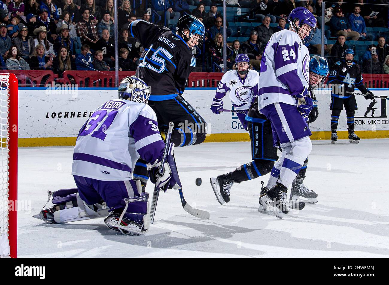U.S. Air Force Academy -- Air Force's Bennett Norlin tries to deflect a ...