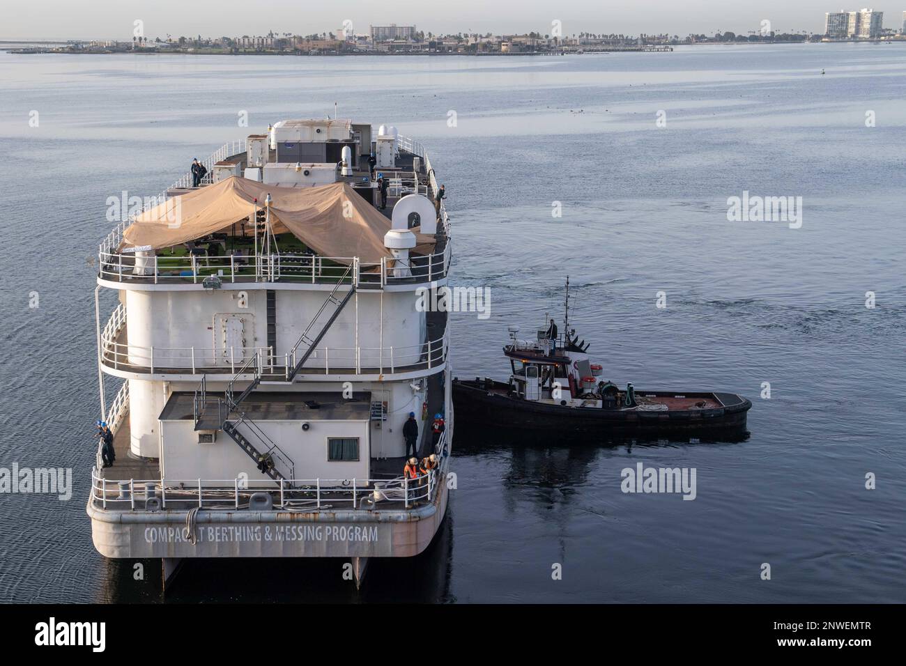 SAN DIEGO (Jan. 13, 2023) A tugboat tows a barge (APL-2), assigned to ...
