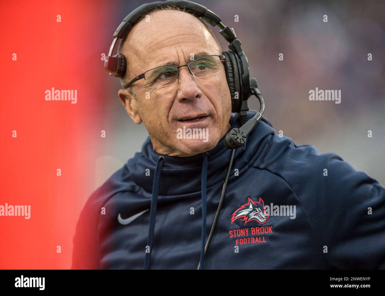 Stony Brook head coach Chuck Priore talks with his assistants on the ...