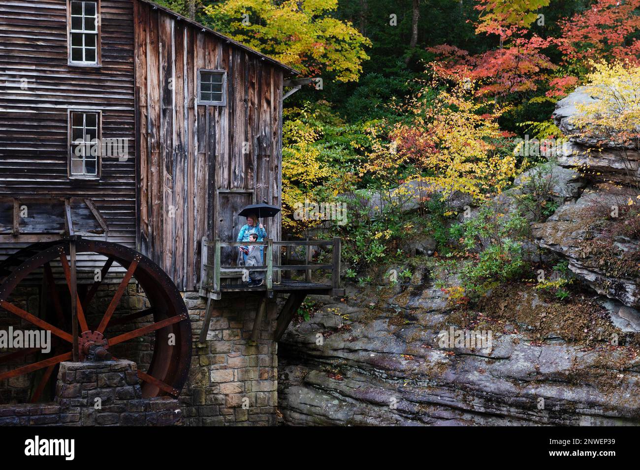 Connie Briles and a child look at the Glade Creek Grist Mill inside ...