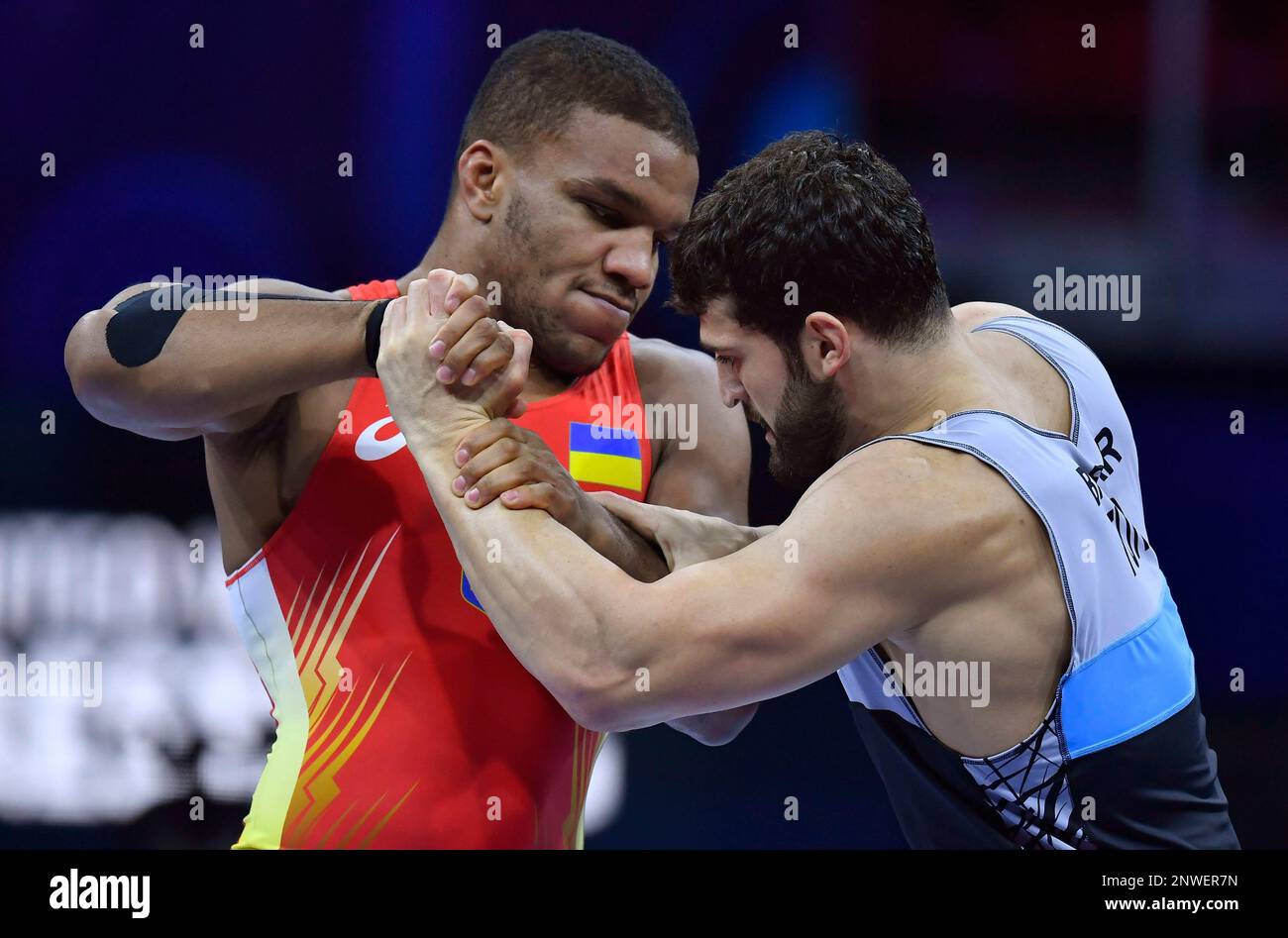 Metehan Basar of Turkey, in blue, wins against Zhan Beleniuk of Ukraine ...