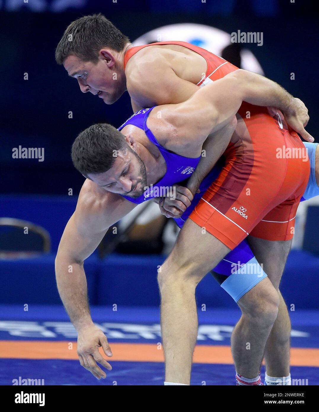 Artem Surkov of Russia, in red, wins against Davor Stefanek of Serbia ...
