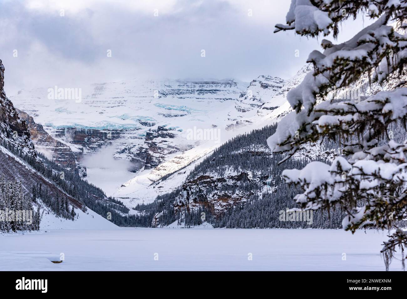 Iconic Lake Louise in winter time with frozen lake below scenic view ...