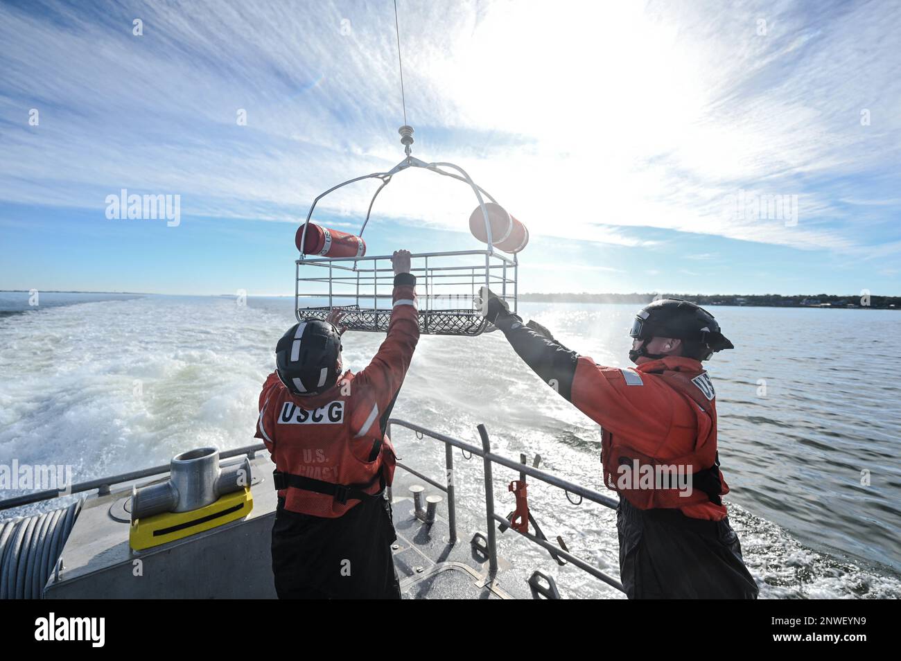 U.S. Coast Guard Seaman Eric Buckle, left, and Boatswains Mate 3rd ...