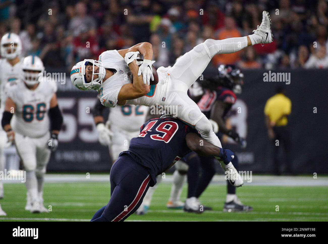 Miami Dolphins wide receiver Danny Amendola (80) is upended by Houston ...