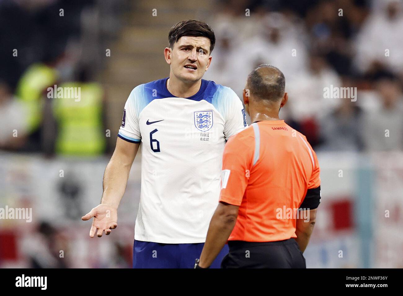 AL KHOR - (LR) Harry Maguire of England, referee Wilton Sampai during ...