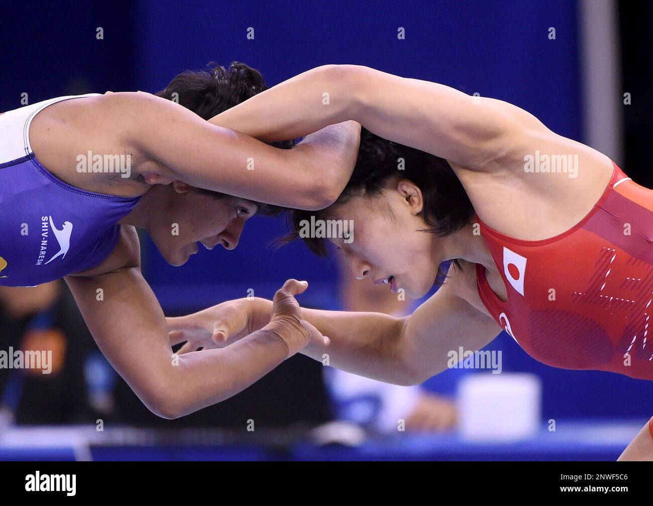 Yui Susaki, in red, of Japan wins against Ritu Phogat of India in the ...