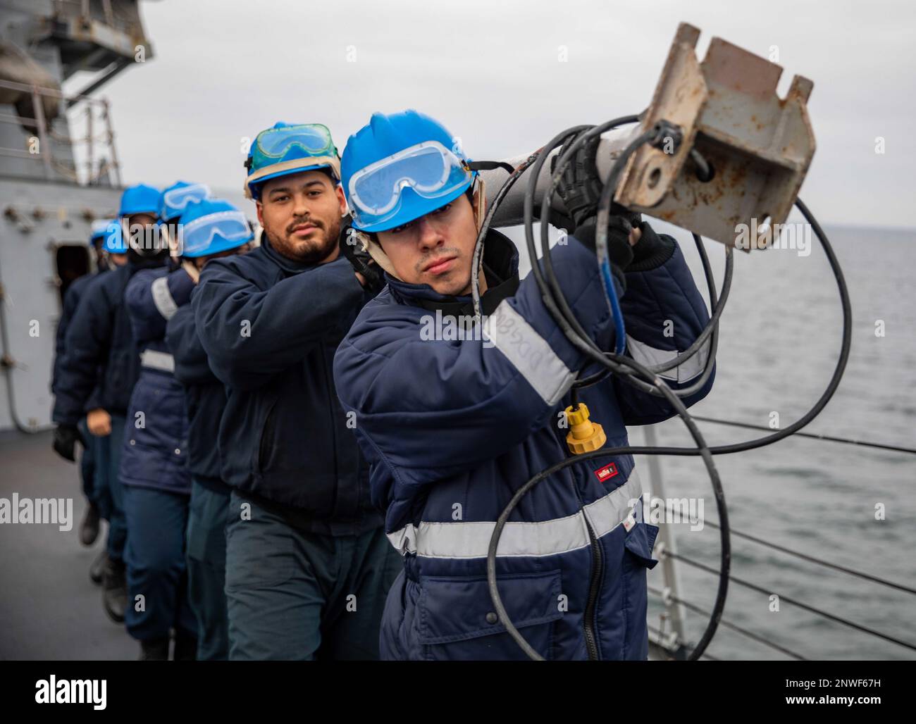 ROSTOCK, Germany (Jan. 7, 2023) Sailors carry a jackstaff on the ...