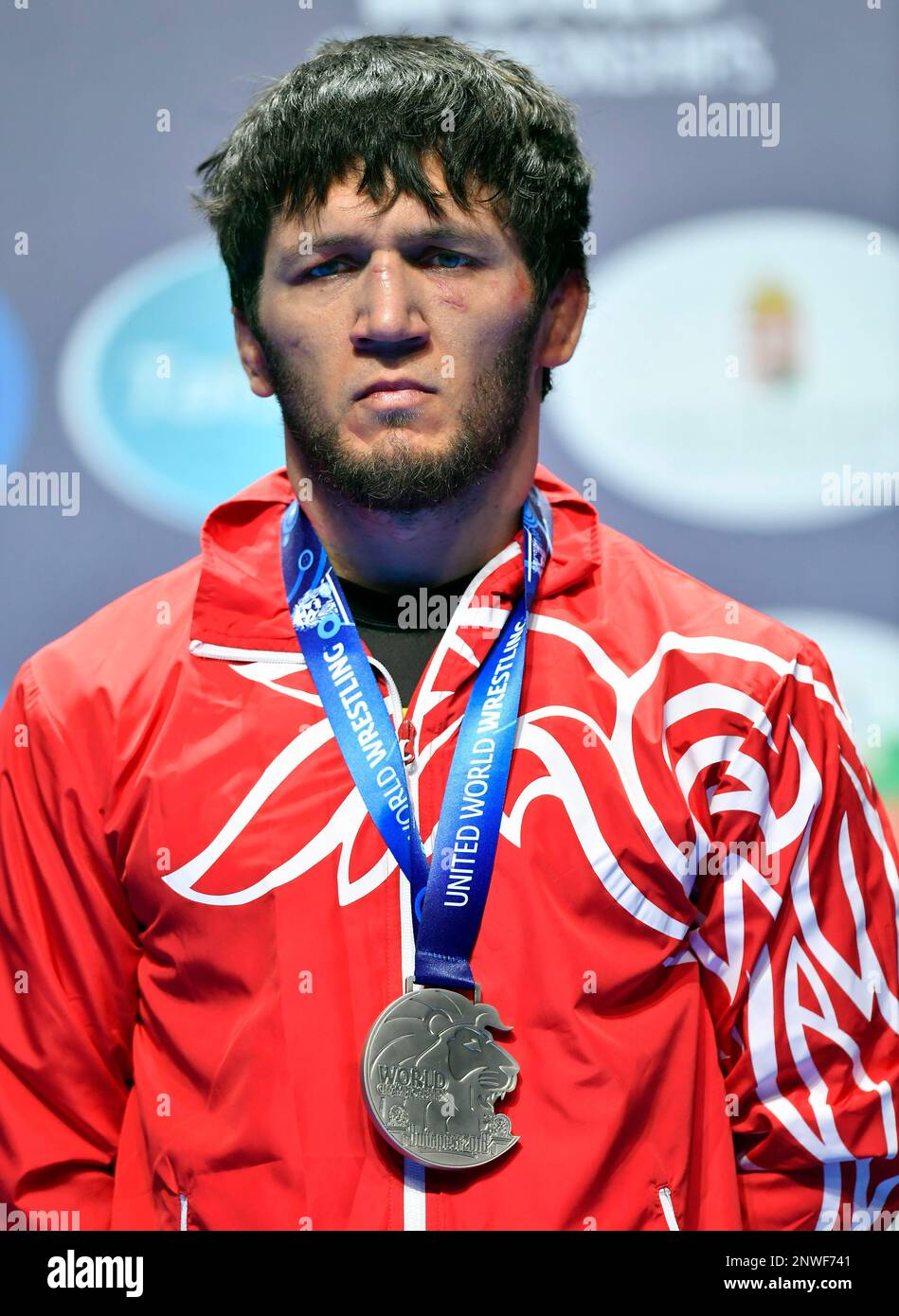 Silver medal winning Adam Batirov of Bahrain stands on the podium ...