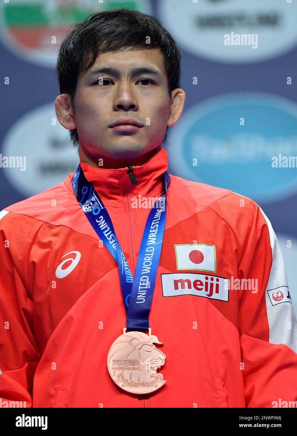 Bronze medal winning Yuki Takahashi of Japan stands on the podium ...