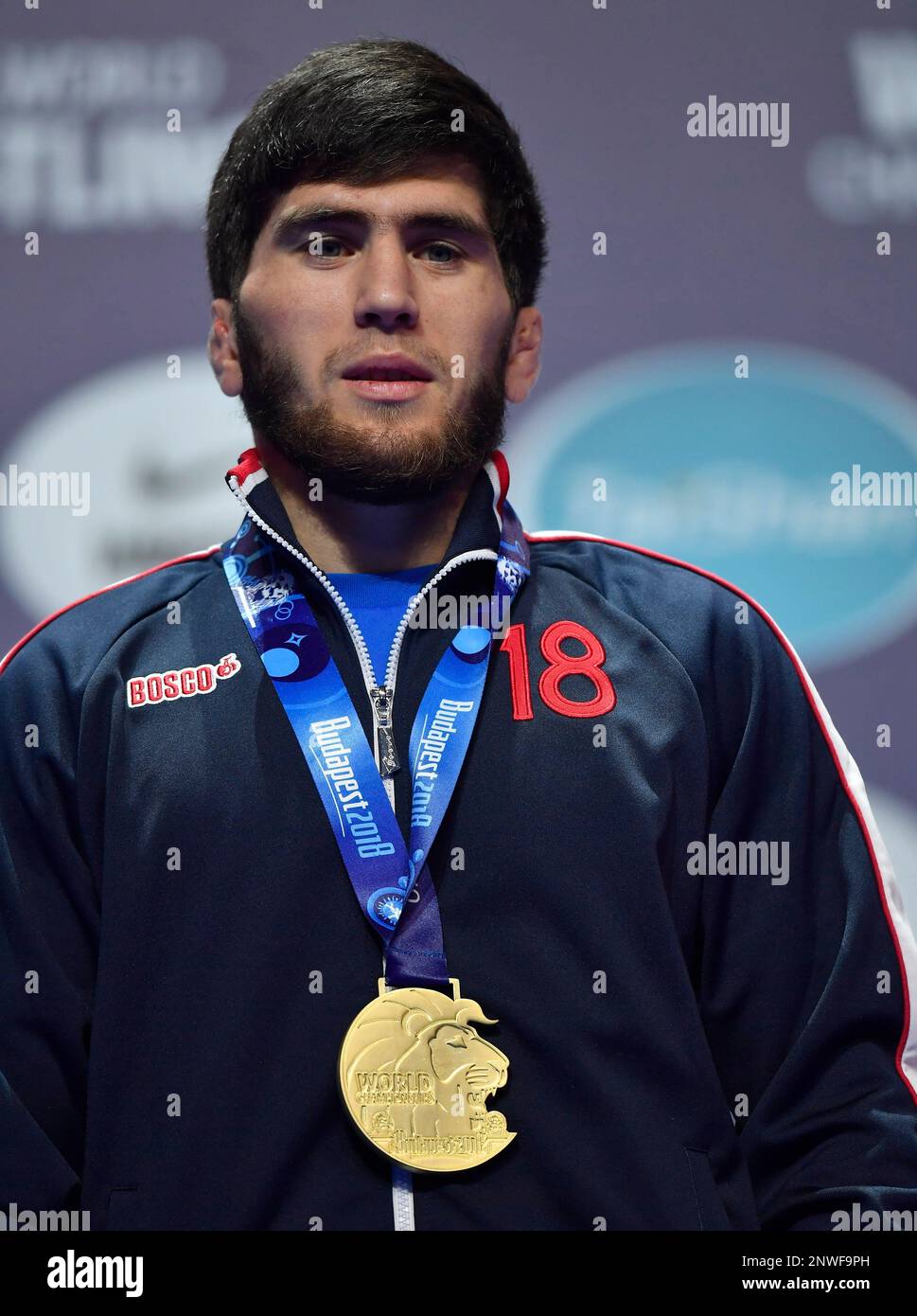 Gold medal winning Zavur Uguev of Russia stands on the podium during ...