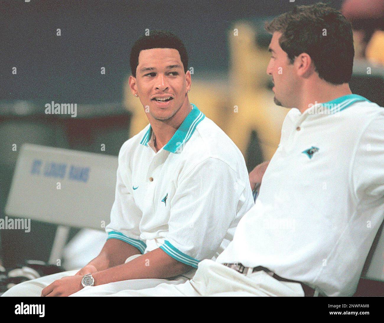 Carolina Panther wide receiver Rae Carruth, left, talks with teammate ...