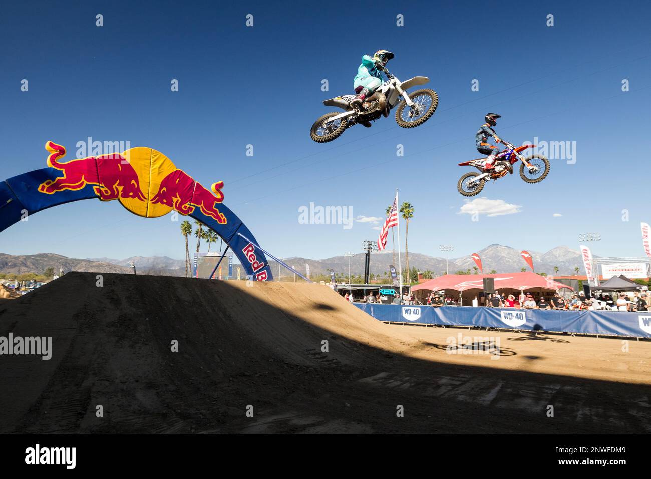 Two riders take to the air off a massive jump at Red Bull Straight ...