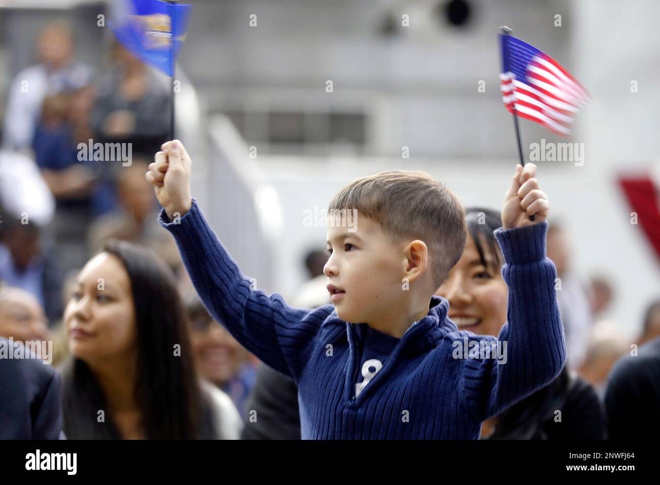 Zachary Ross waves Delaware's state flag and the U.S. flag during the ...