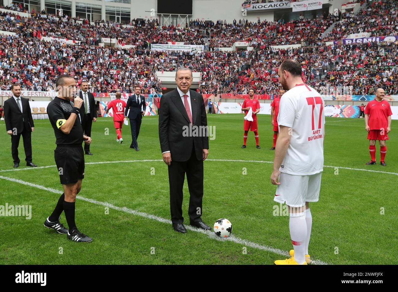 Turkish President Recep Tayyip Erdogan, centre, opens a charity soccer ...